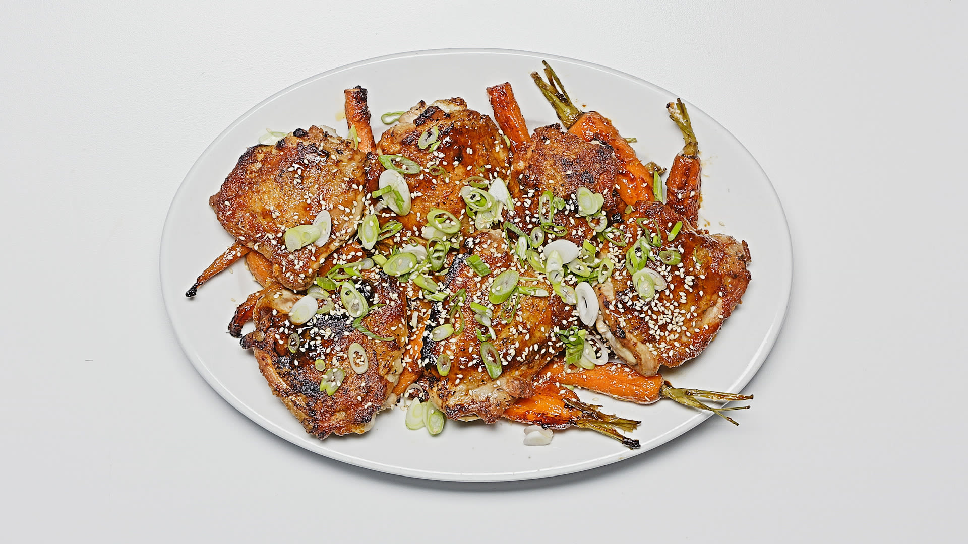 Watch One-Skillet Roasted Sesame Chicken Thighs with Carrots | Bon Appétit