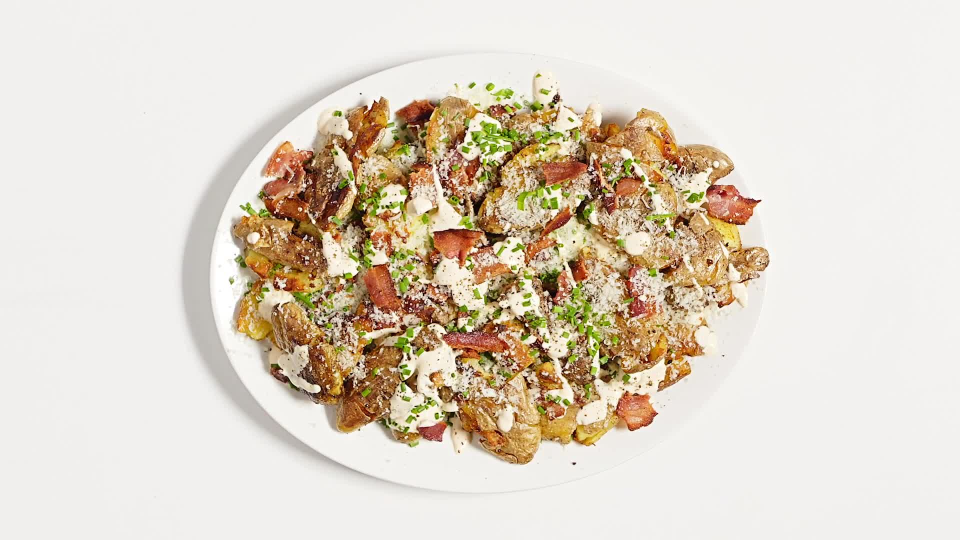 Watch Smashed and Crispy Loaded Potatoes | Bon Appétit