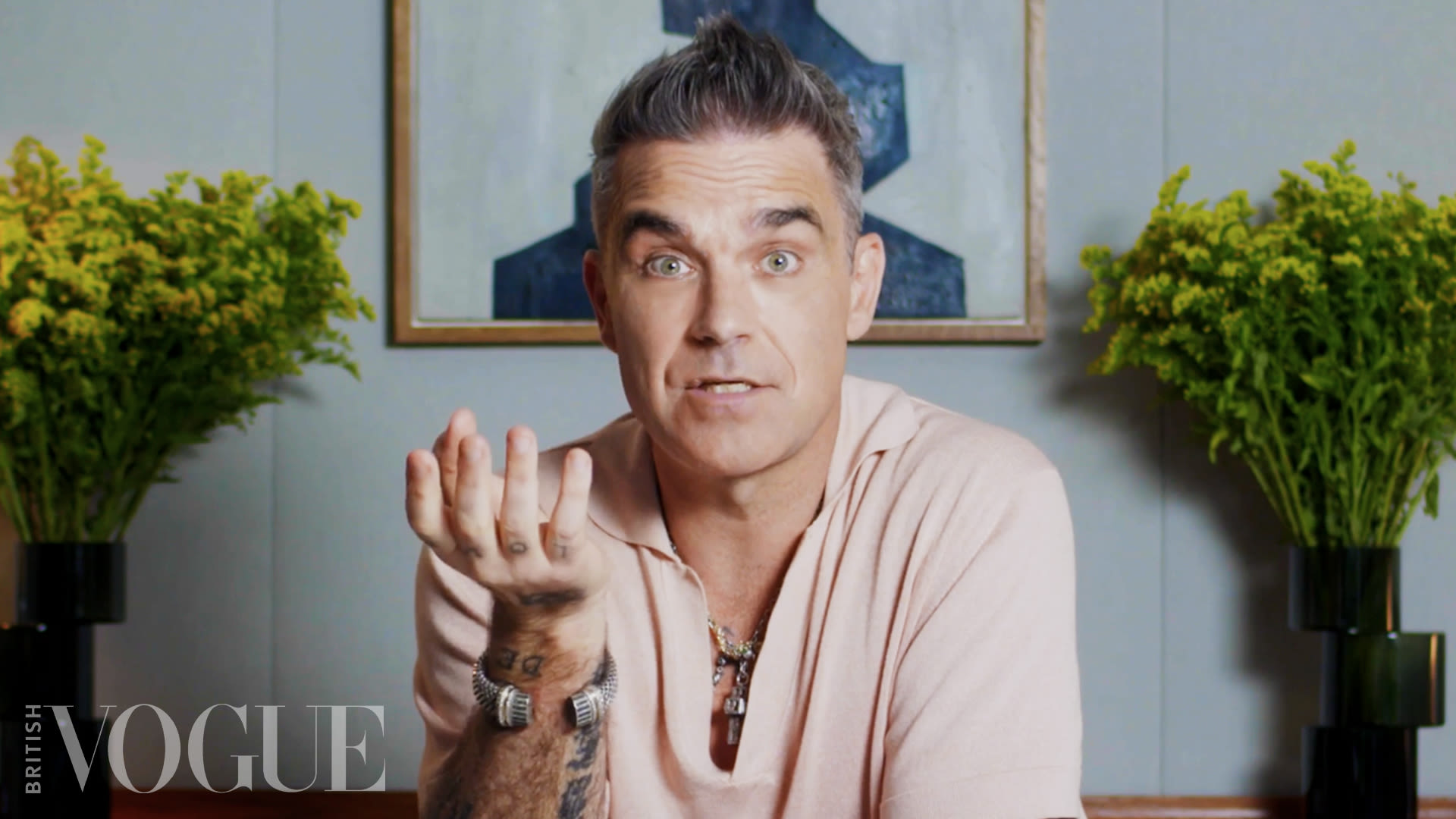 Watch Robbie Williams Breaks Down 18 Memorable Looks From 1990 To Now ...